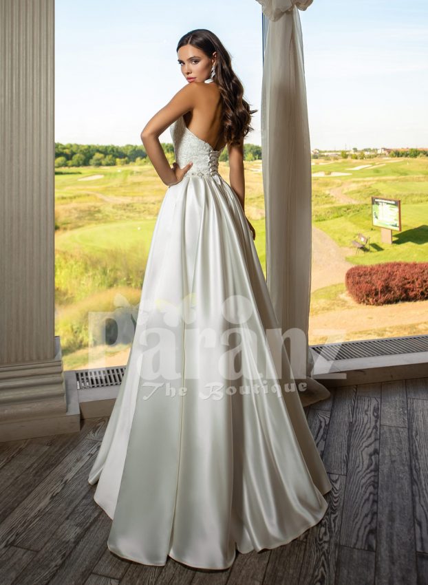 Closed neck and open back flared satin wedding gown with tulle skirt ...